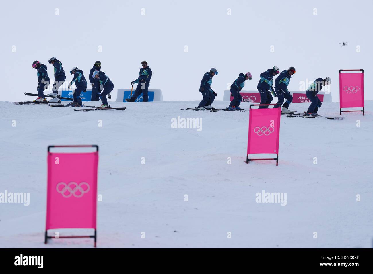 Slippers prep the moguls course during the men's freestyle skiing ...