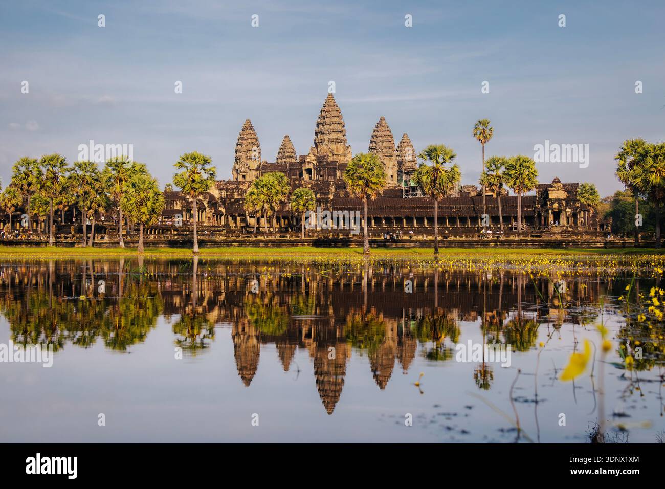 Angkor Wat temple reflected in water. Ancient civilization complex ...