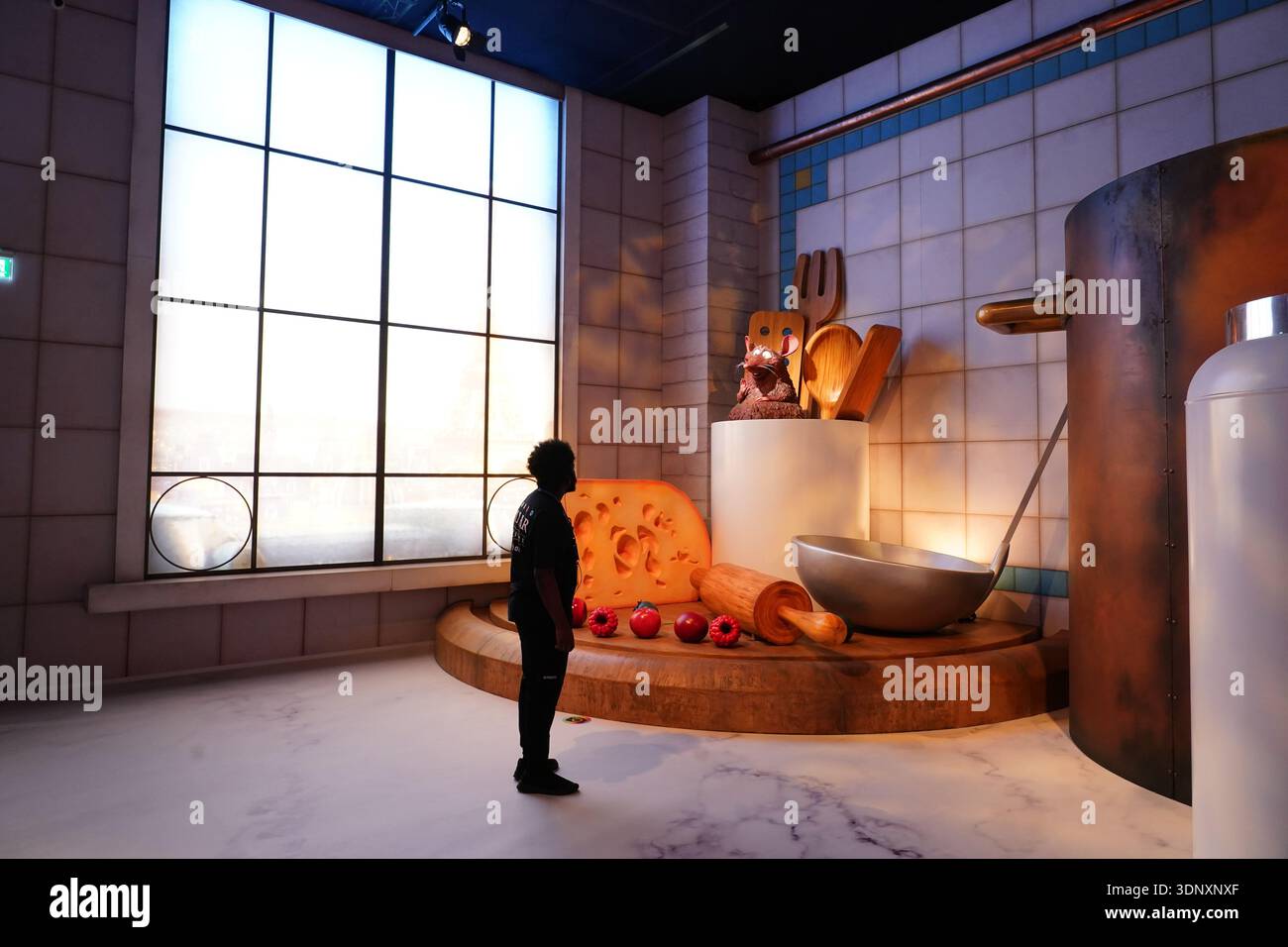 A visitor looks at Emile from Ratatouille, one of the exhibits at the ...