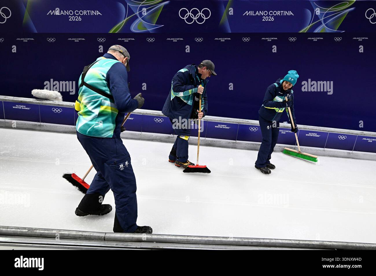 Sweepers prepare the course for the Men's Skeleton Heat 2 on day six of ...