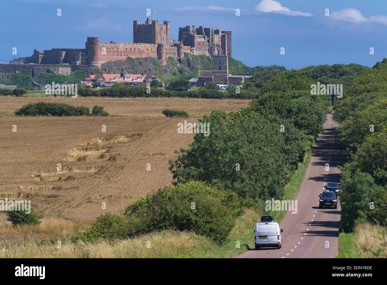 Stunning Bamburgh Castle on sandy Northumberland shore. Looking south ...