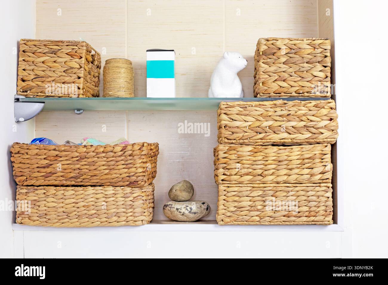 Interior design with glass shelves in the bathroom and cattail storage ...