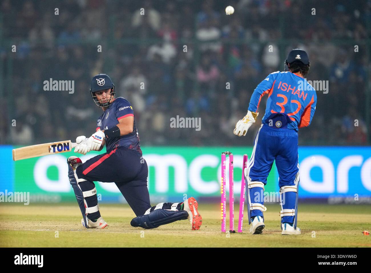Namibia's JJ Smit is bowled out by India's Varun Chakravarthy during ...