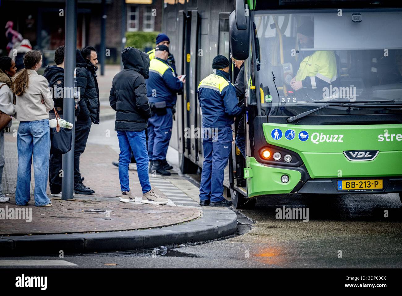 GOUDA - Public transport check at a qbuzz public transport ROBIN ...