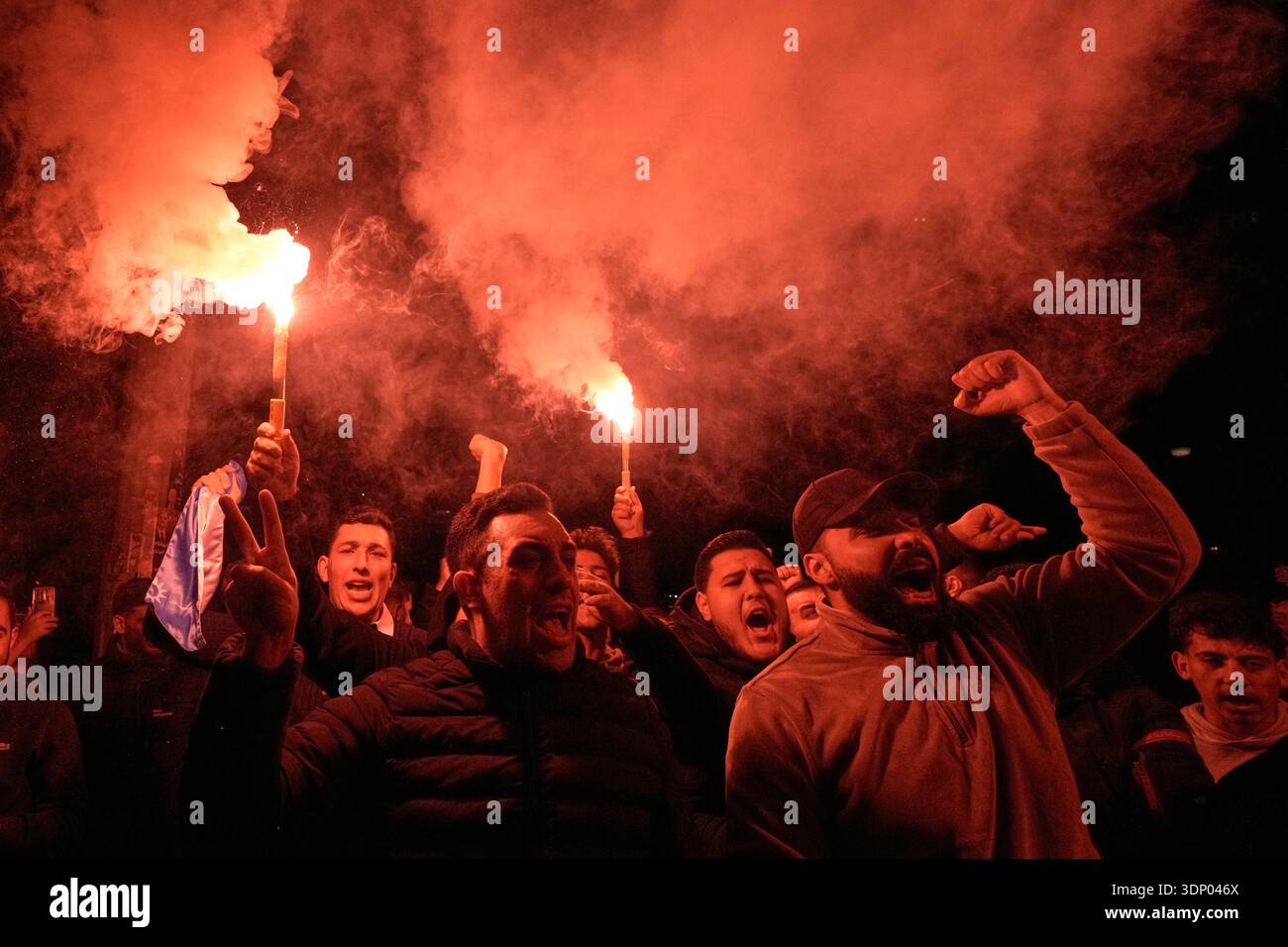 Supporters of the Future Movement light flares and chant slogans during ...