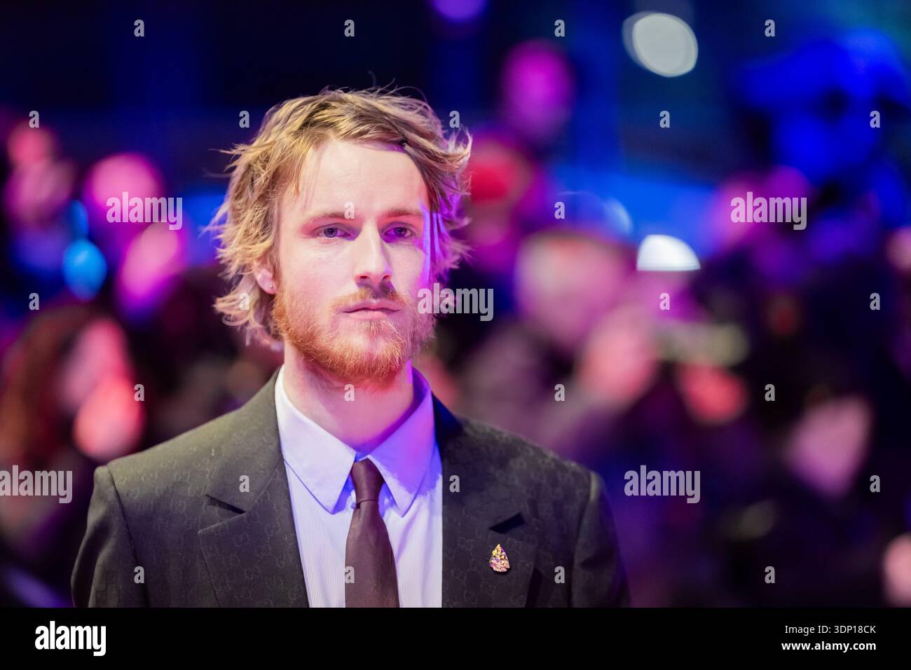 12 February 2026, Berlin: Louis Hofmann, actor, stands on the red ...