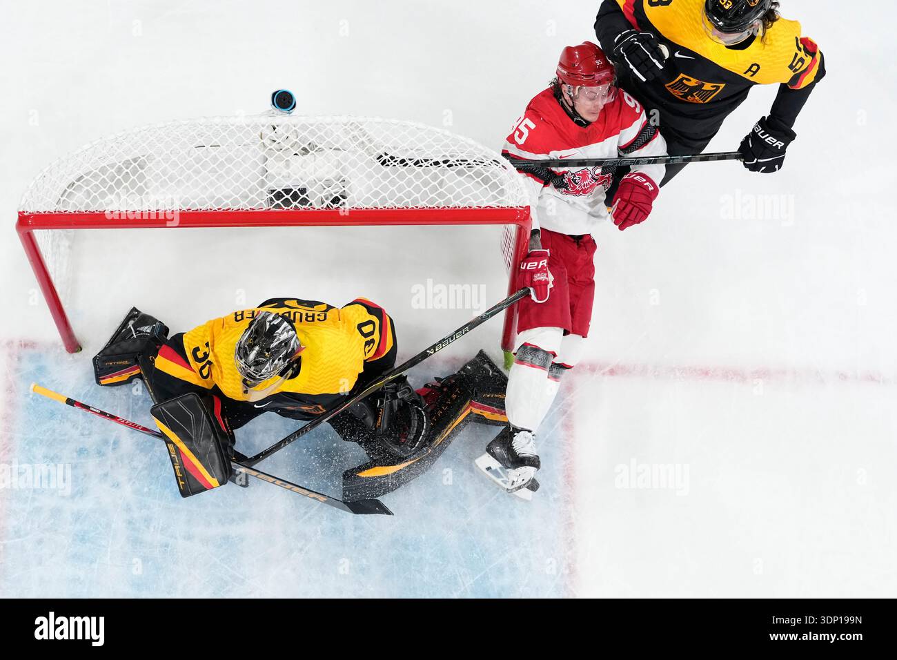 Denmark's Nick Olesen (95) is challenged by Germany's Moritz Seider (53 ...