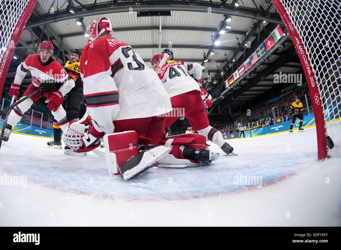 Germany's Tim Stutzle, covered, scores his side's third goal during a ...