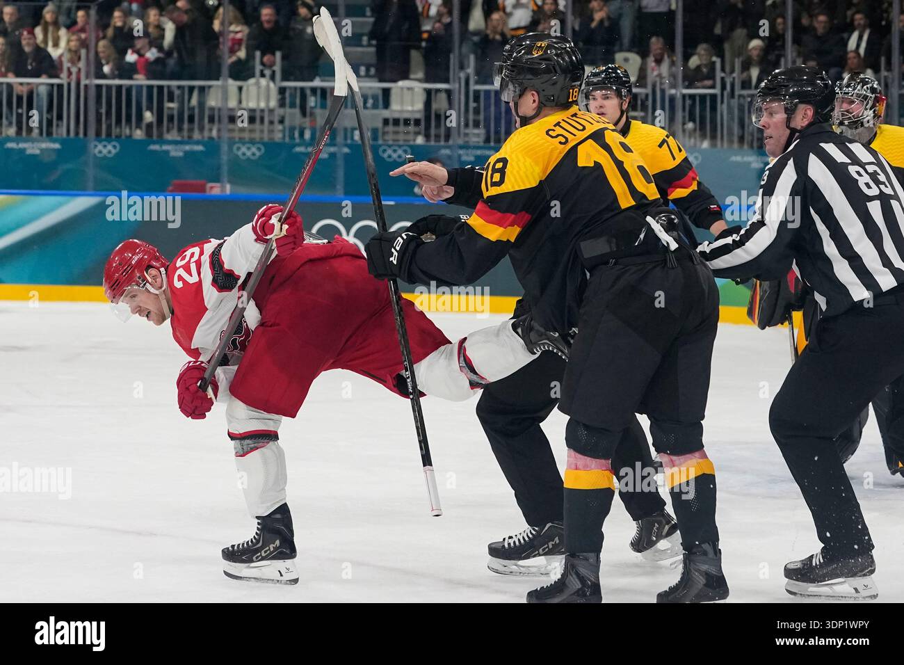 Germany's Tim Stutzle (18), right, fights with Denmark's Mikkel Aagaard ...