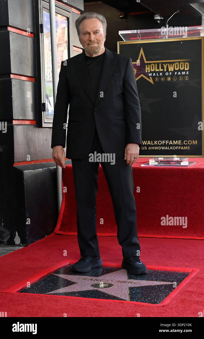 Italian actor Franco Nero stands on his star during an unveiling ...