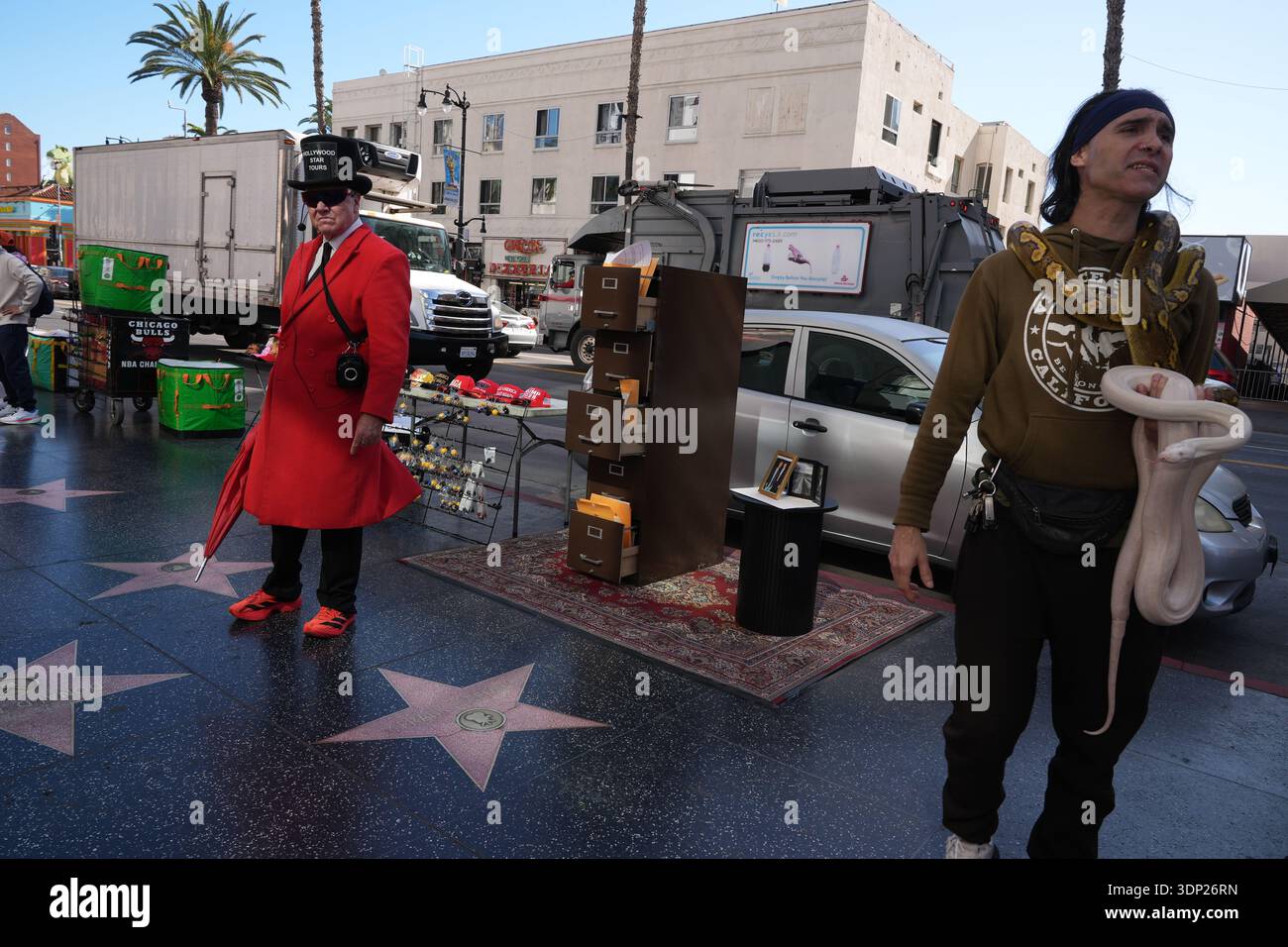 Gregg Donovan, left, stands next to the defaced Walk of Fame star ...