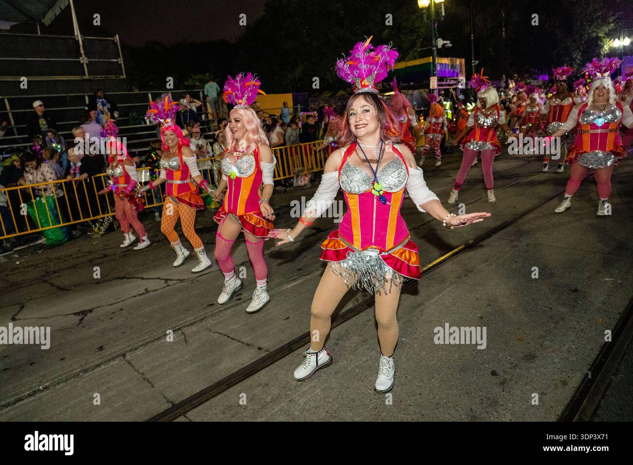 Attendees participate in the annual Krewe of Muses parade during the ...