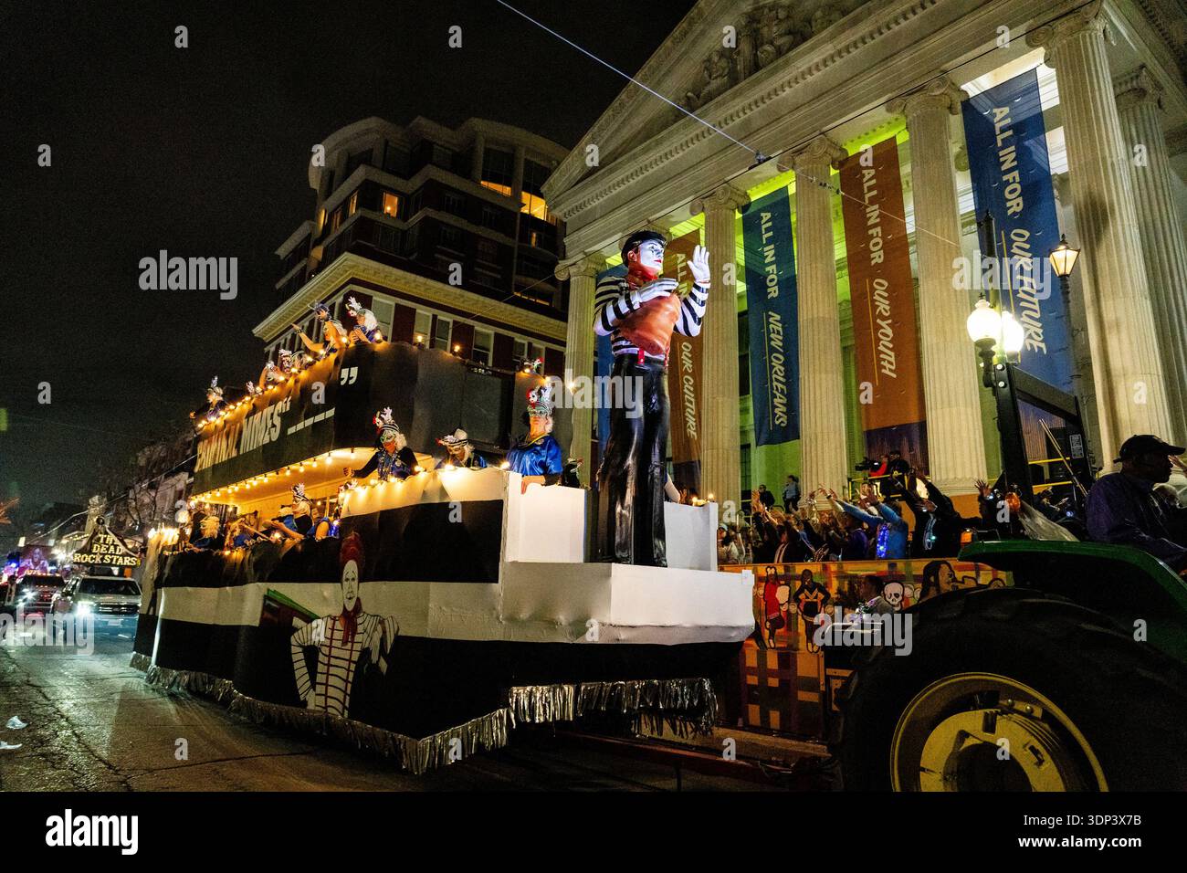 Attendees participate in the annual Krewe of Muses parade during the ...