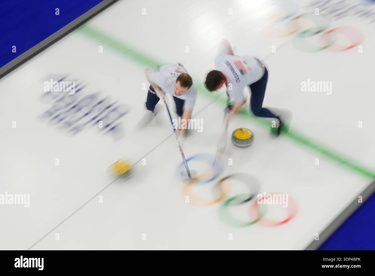 United States' Aidan Oldenburg and Luc Violette sweep ahead of a stone ...