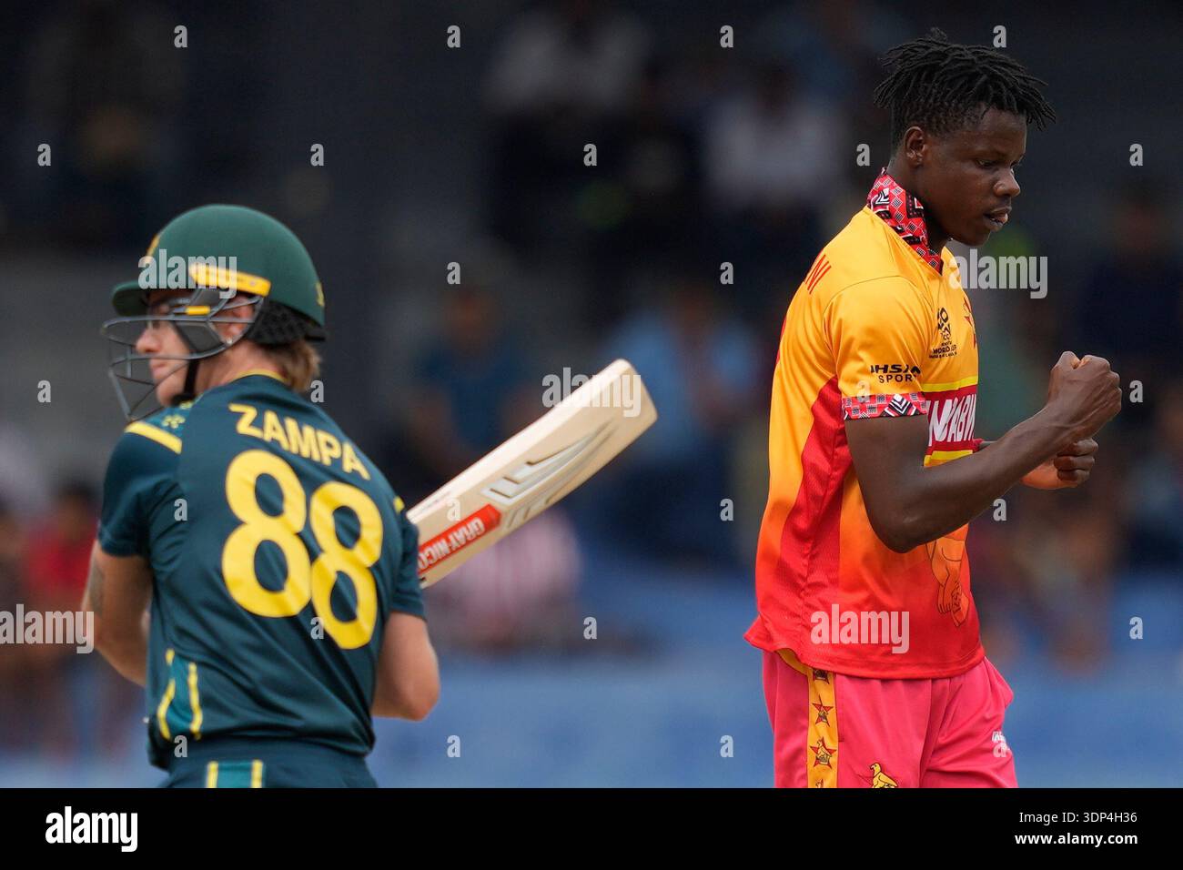 Zimbabwe's Blessing Muzarabani, right, celebrates the wicket of ...