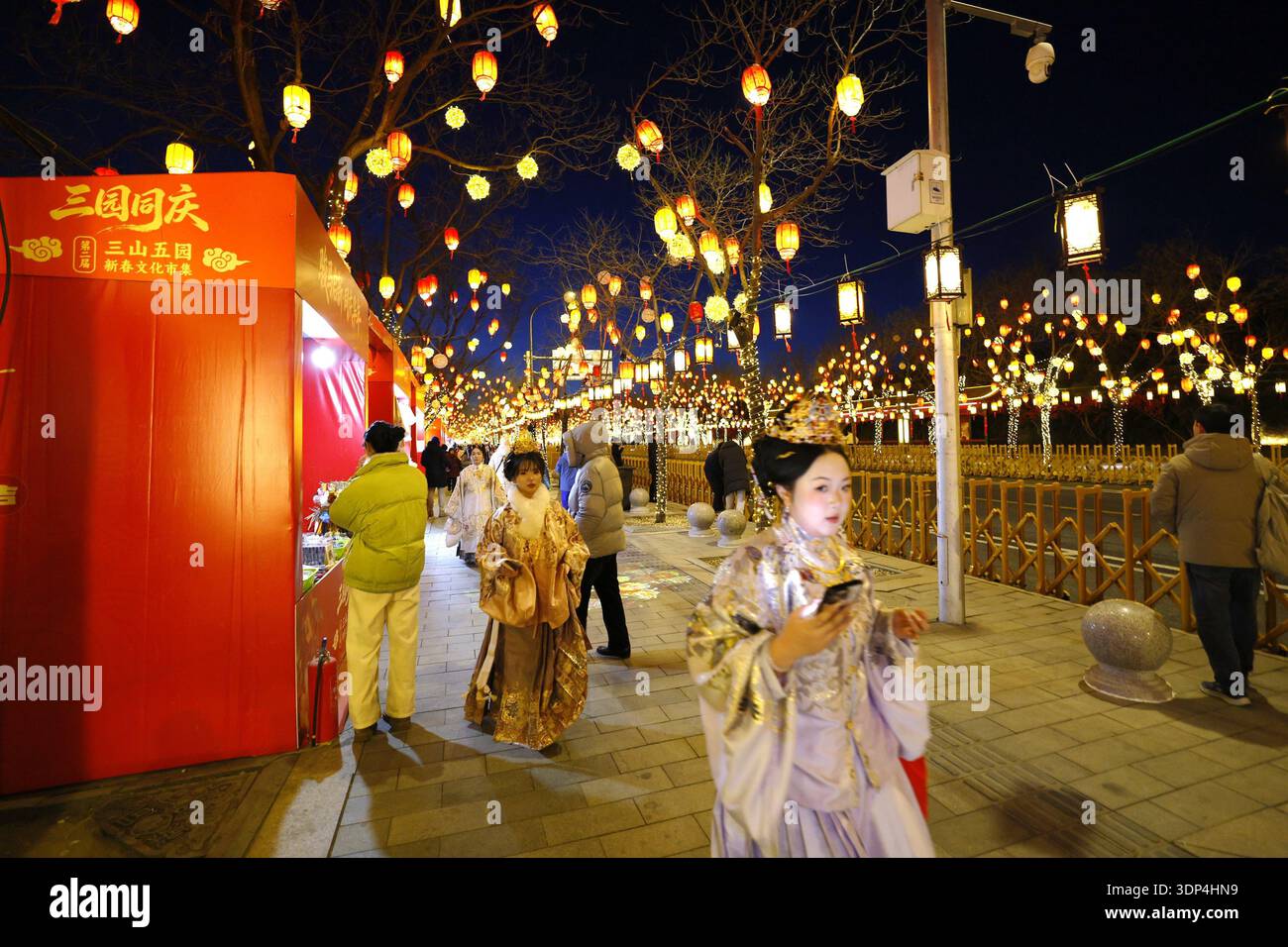 Visitors admire lanterns at Tongqing Street in the Summer Palace in ...