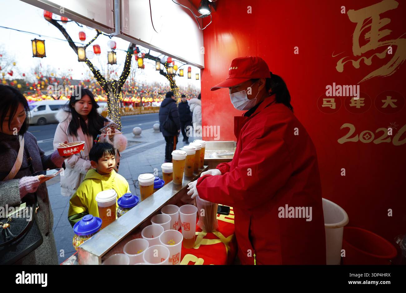 Visitors admire lanterns at Tongqing Street in the Summer Palace in ...
