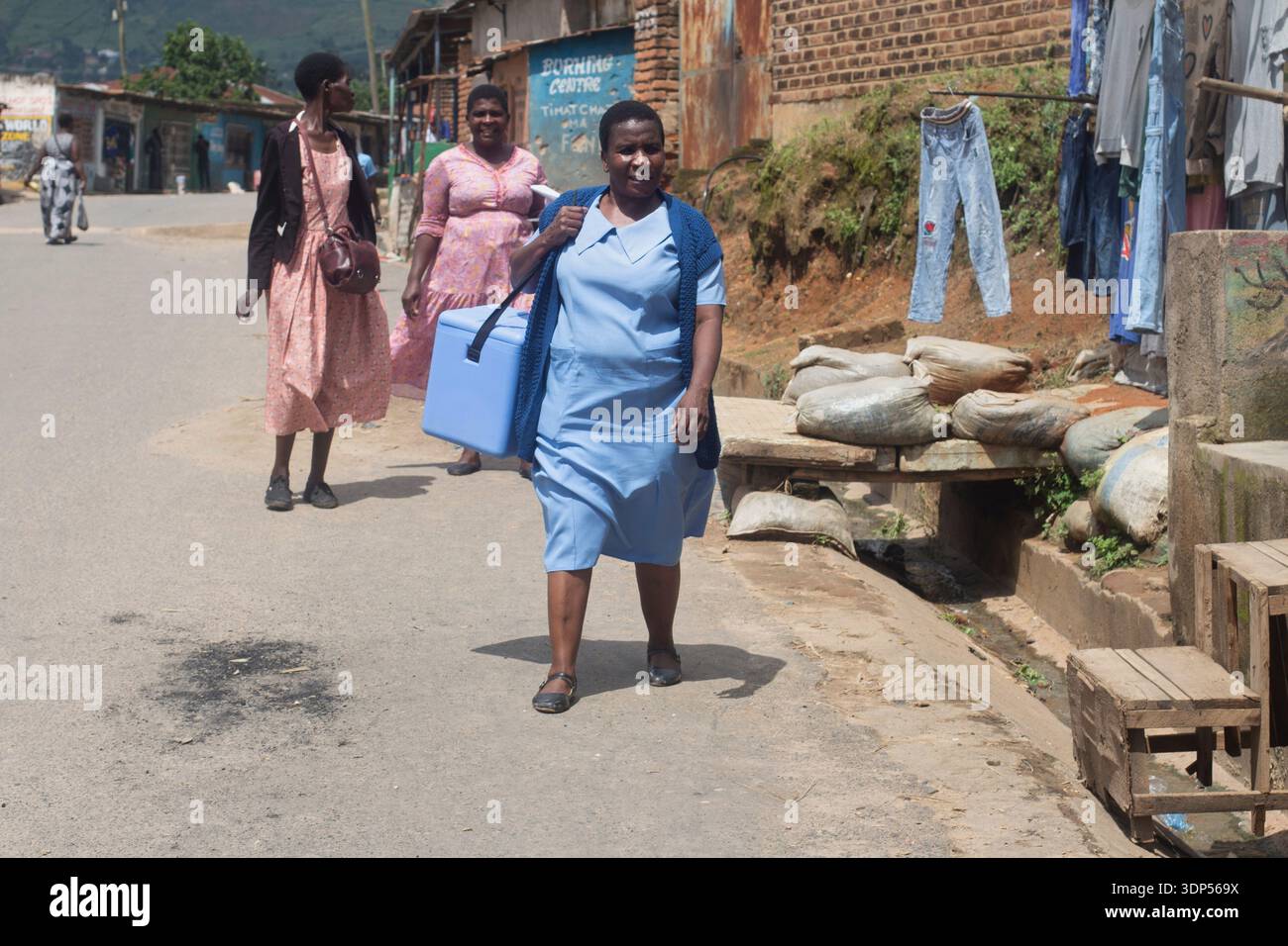 Health workers get ready to administer oral polio vaccines to children ...