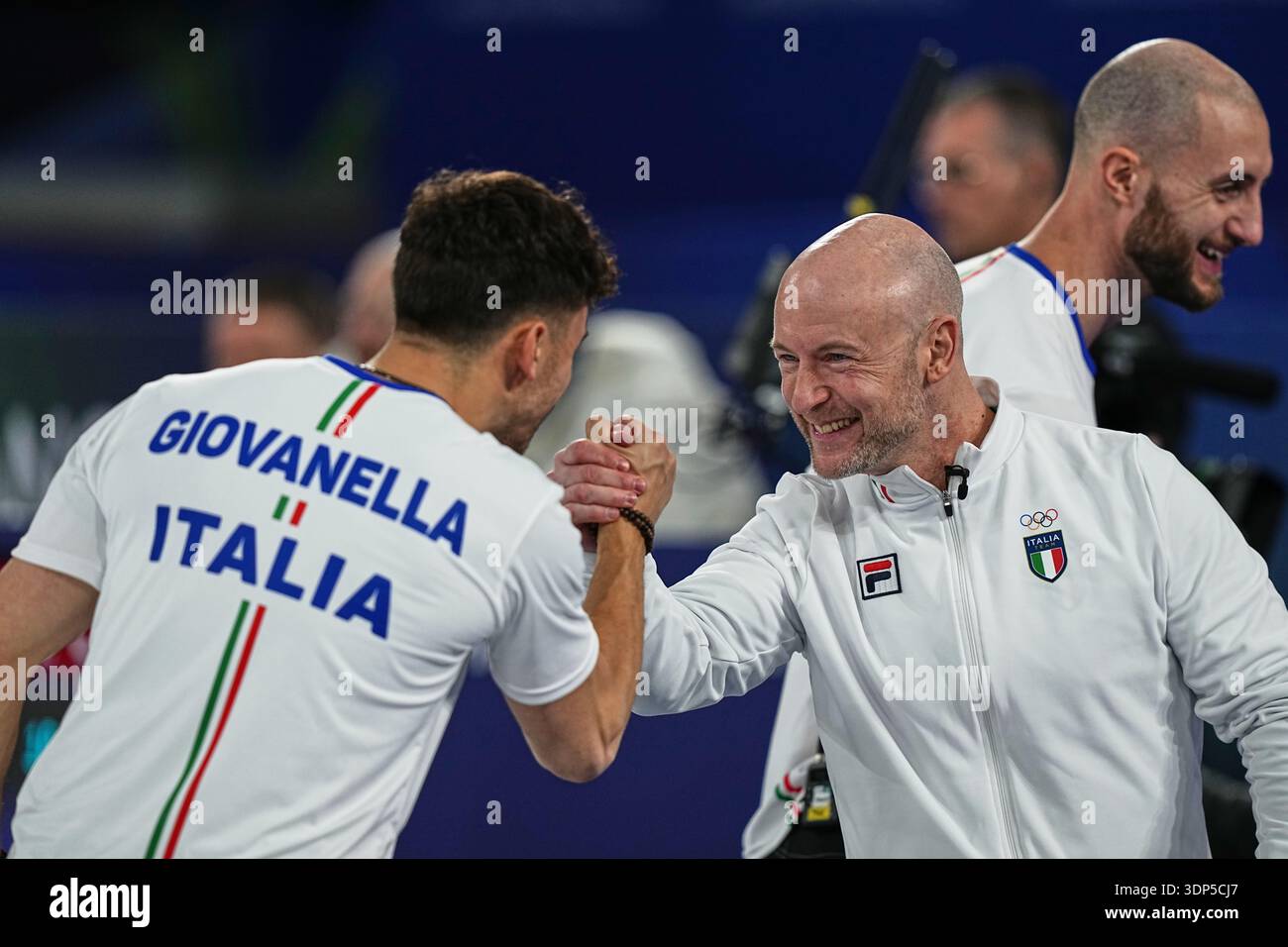 Italy's Mattia Giovanella and his coach Ryan Fry react after the men's ...