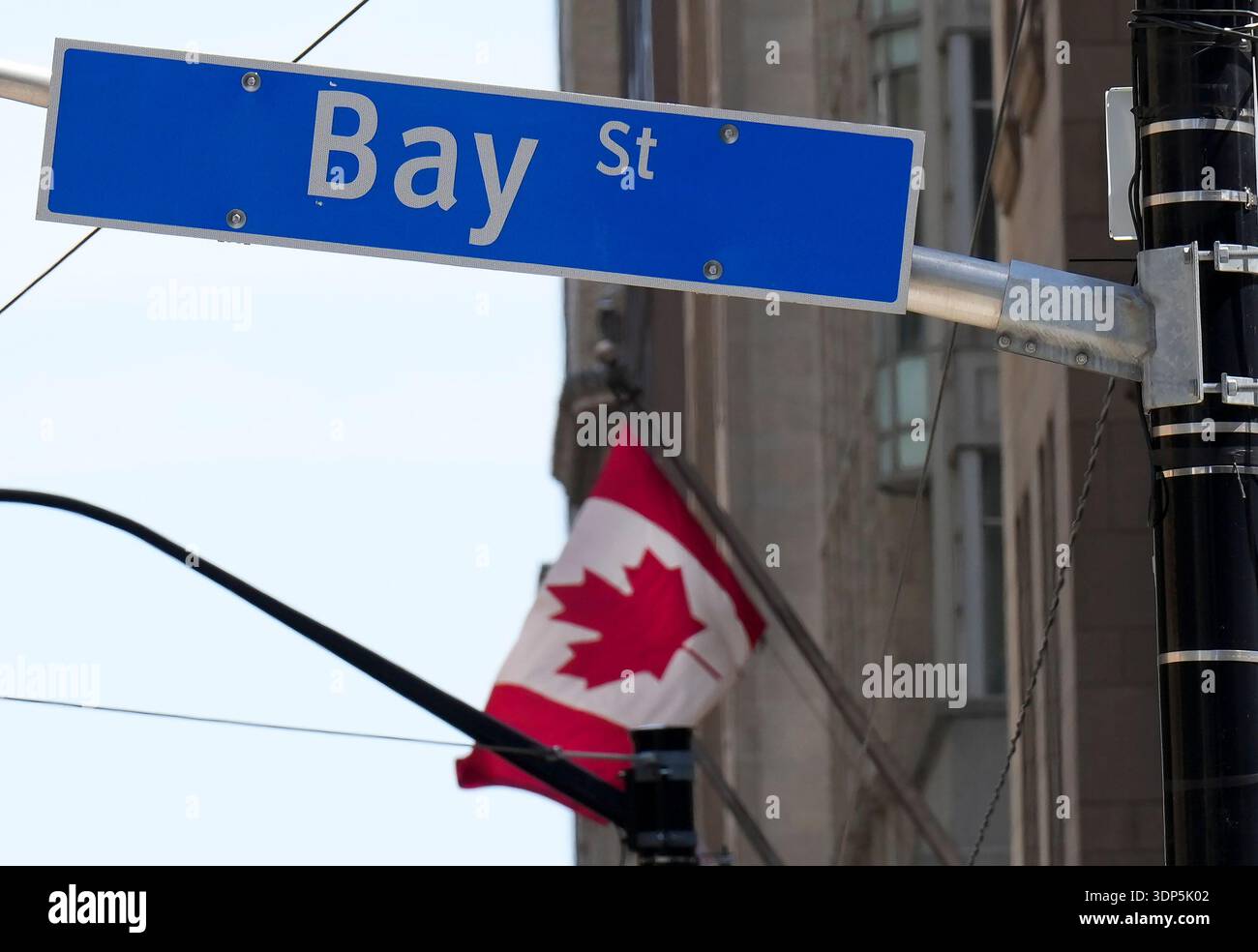 The Bay Street Financial District is shown with the Canadian flag in ...