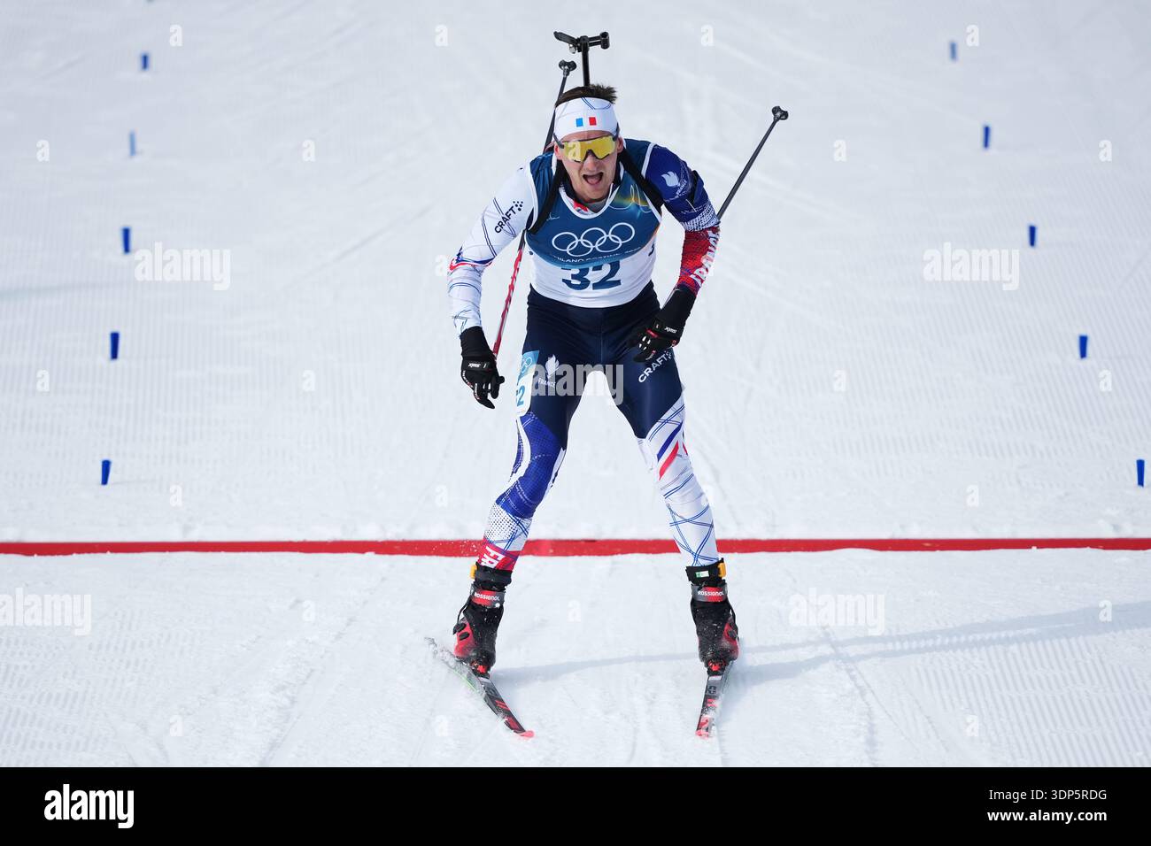 Fabien Claude, of France, crosses the finish line during the men's 10 ...