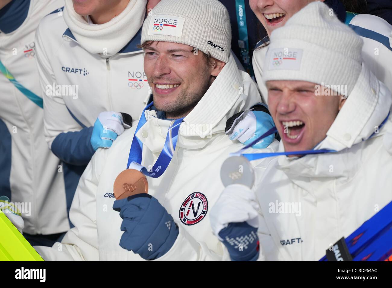 Bronze medalist Sturla Holm Laegreid, of Norway, left, poses next to ...