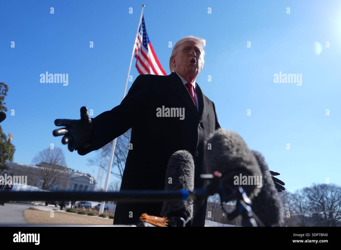 President Donald Trump speaks with reporters before boarding Marine One ...