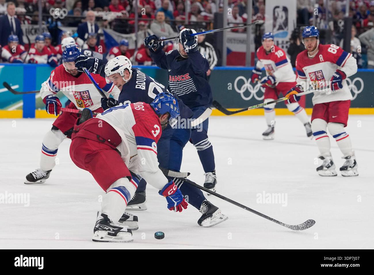 Czechia's Radko Gudas, left, challenges France's Louis Boudon during a ...