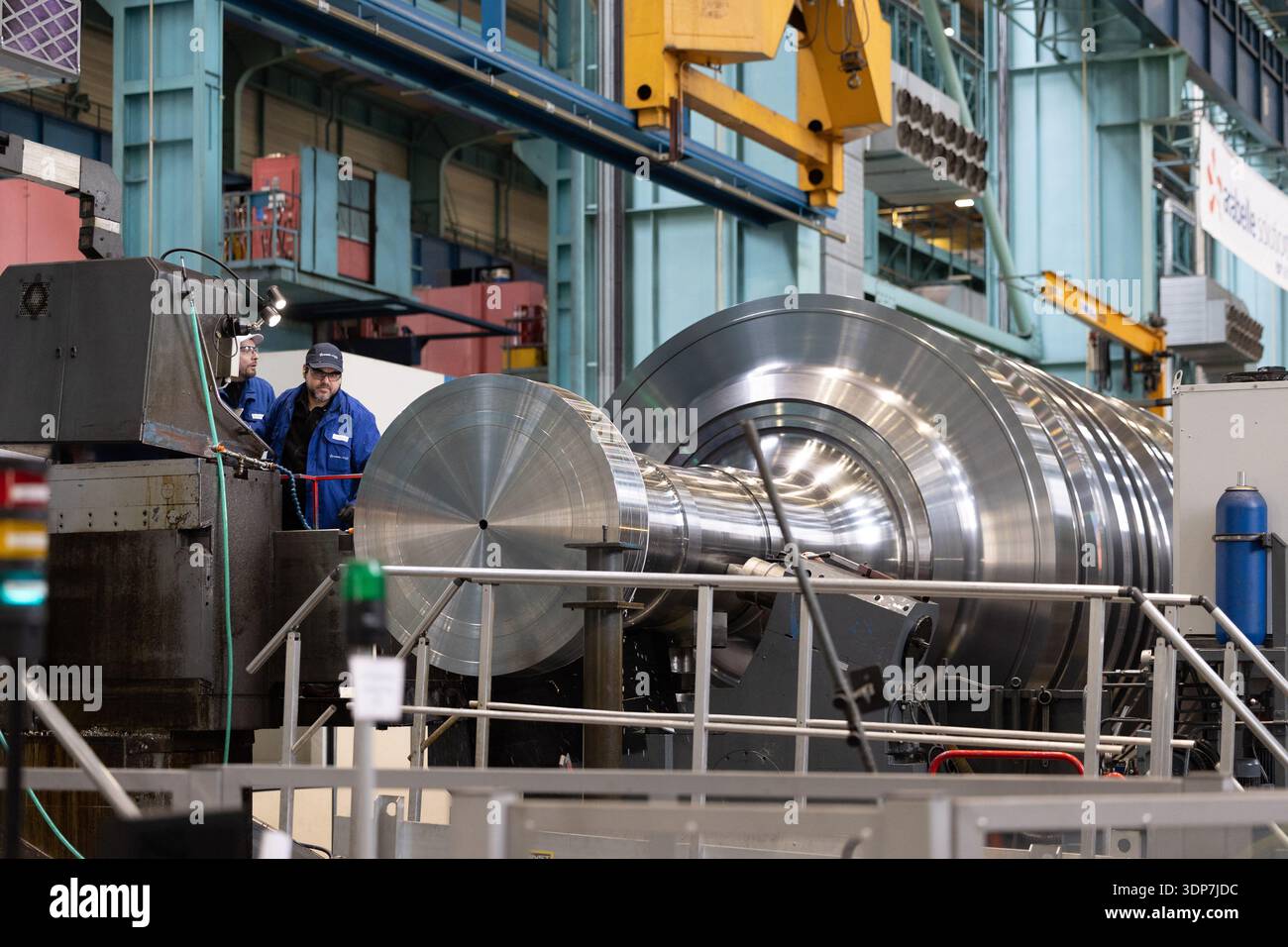 An Arabelle Solutions' employee work on a steam turbine rotor for ...