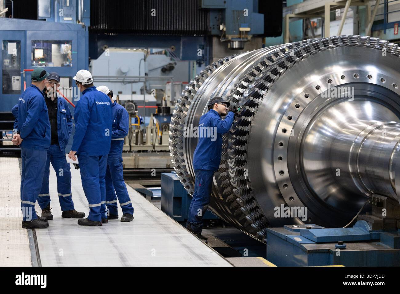 An Arabelle Solutions' employee work on a steam turbine rotor for ...