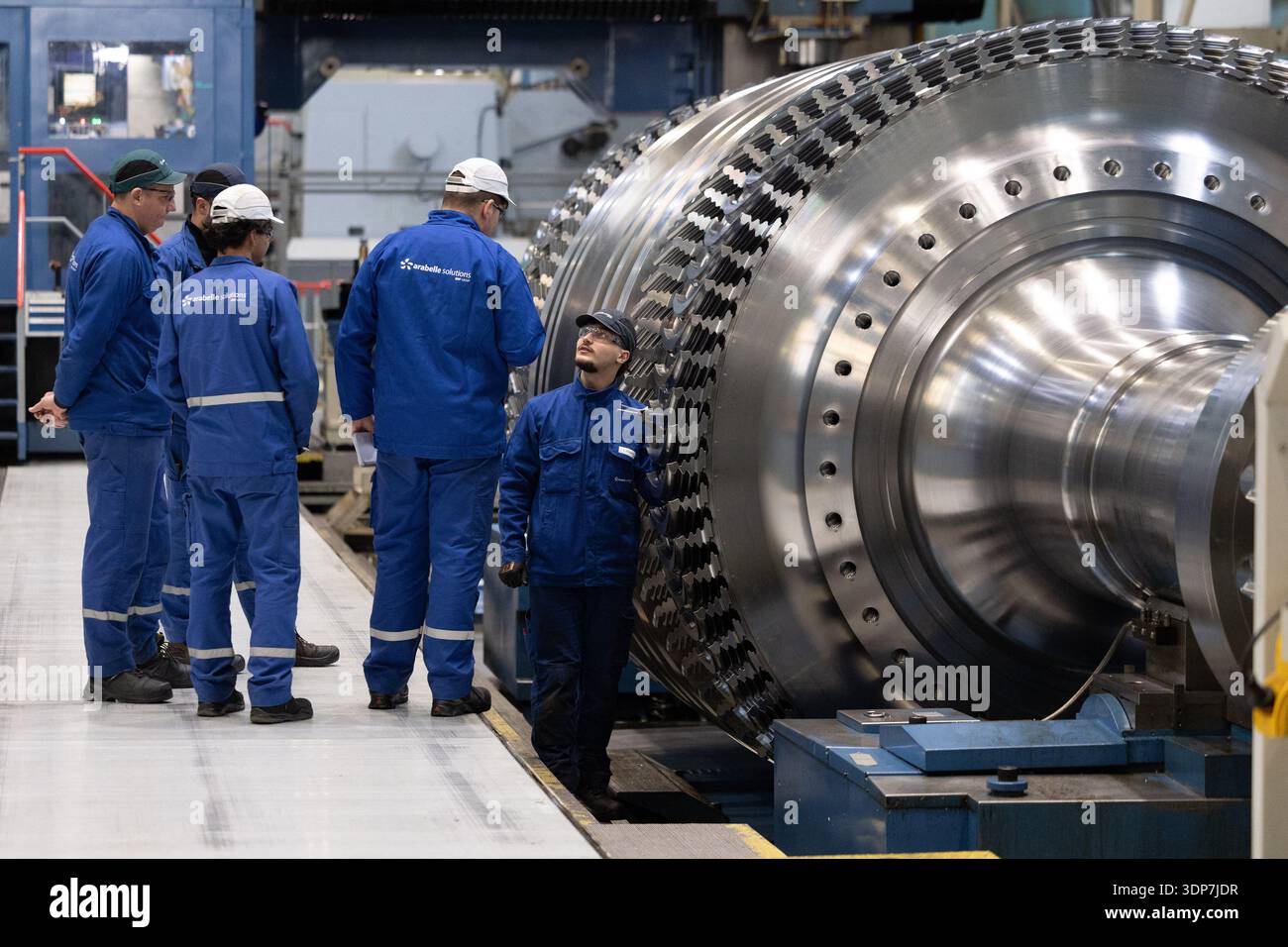 An Arabelle Solutions' employee work on a steam turbine rotor for ...