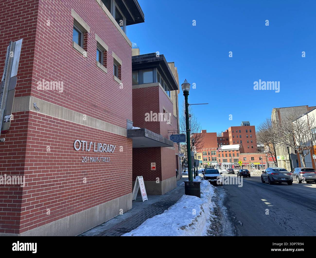 Cars pass by the Otis Library in Norwich, Conn., on Friday, Feb. 13 ...
