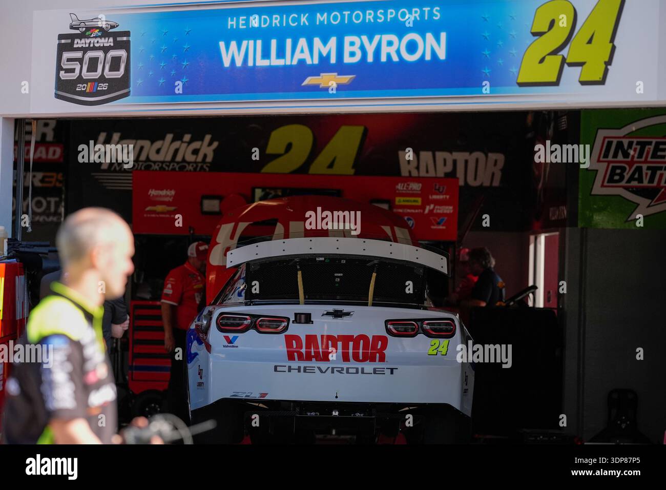 Crews work on William Byron's car in the garage before practice at the ...