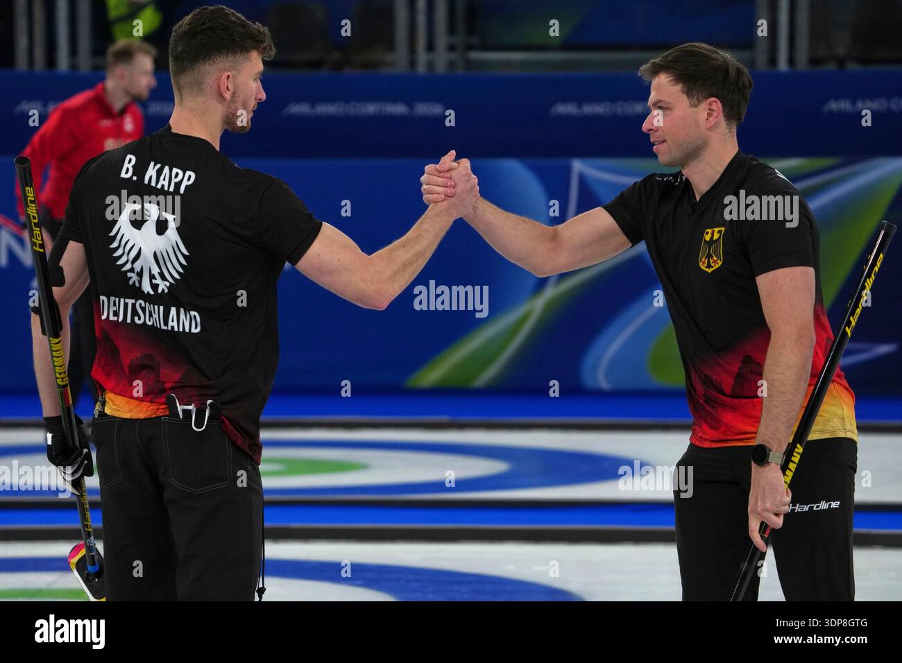 Germany's Marc Muskatewitz and Benjamin Kapp clasp hands after the men ...