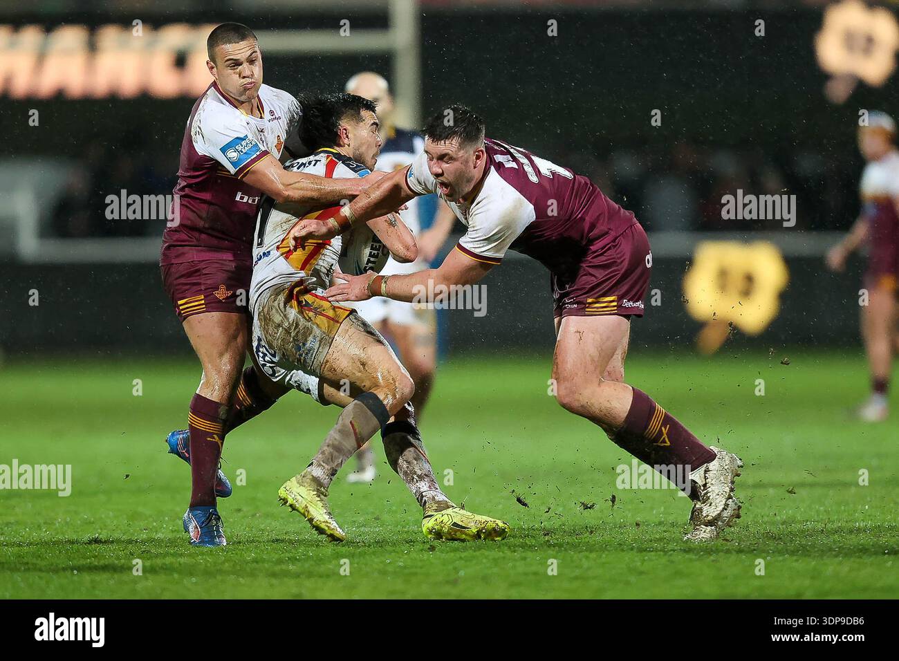 James Greenwood and Tui Lolohea tackle Charlie Staines during the ...