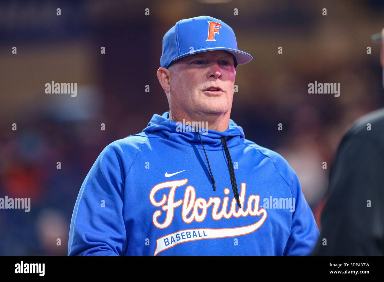 Florida head associate coach Tom Slater meets with officials before an ...
