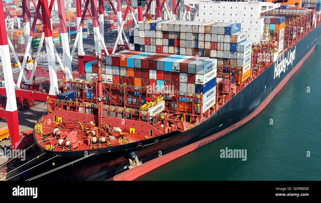 QINGDAO, CHINA - FEBRUARY 14, 2026 - A cargo ship is loading and ...