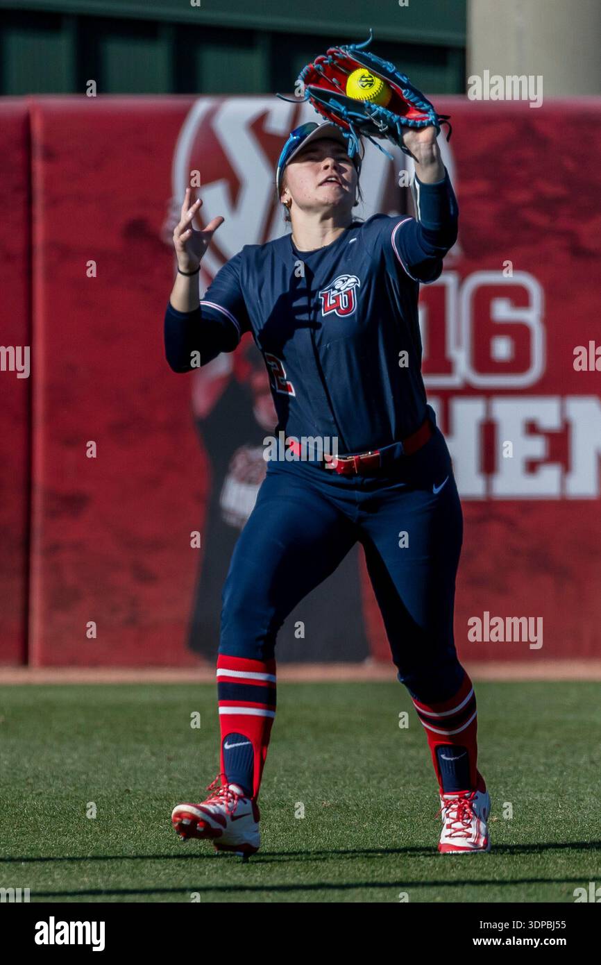 Liberty outfielder Savannah Nash (12) fields a fly ball during an NCAA ...