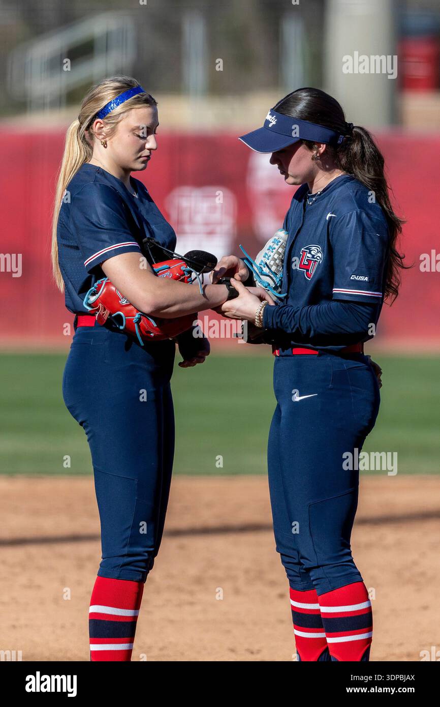 Liberty pitcher Katie Love, right, places a pitcher's watch on the ...
