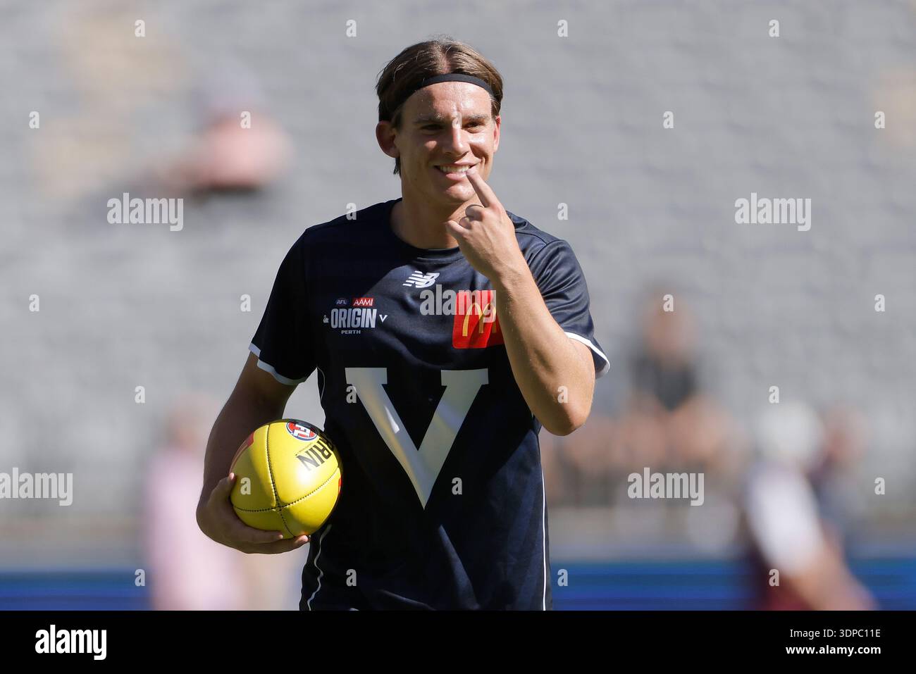 Caleb Serong of Victoria is seen warming up before the AFL Origin match ...