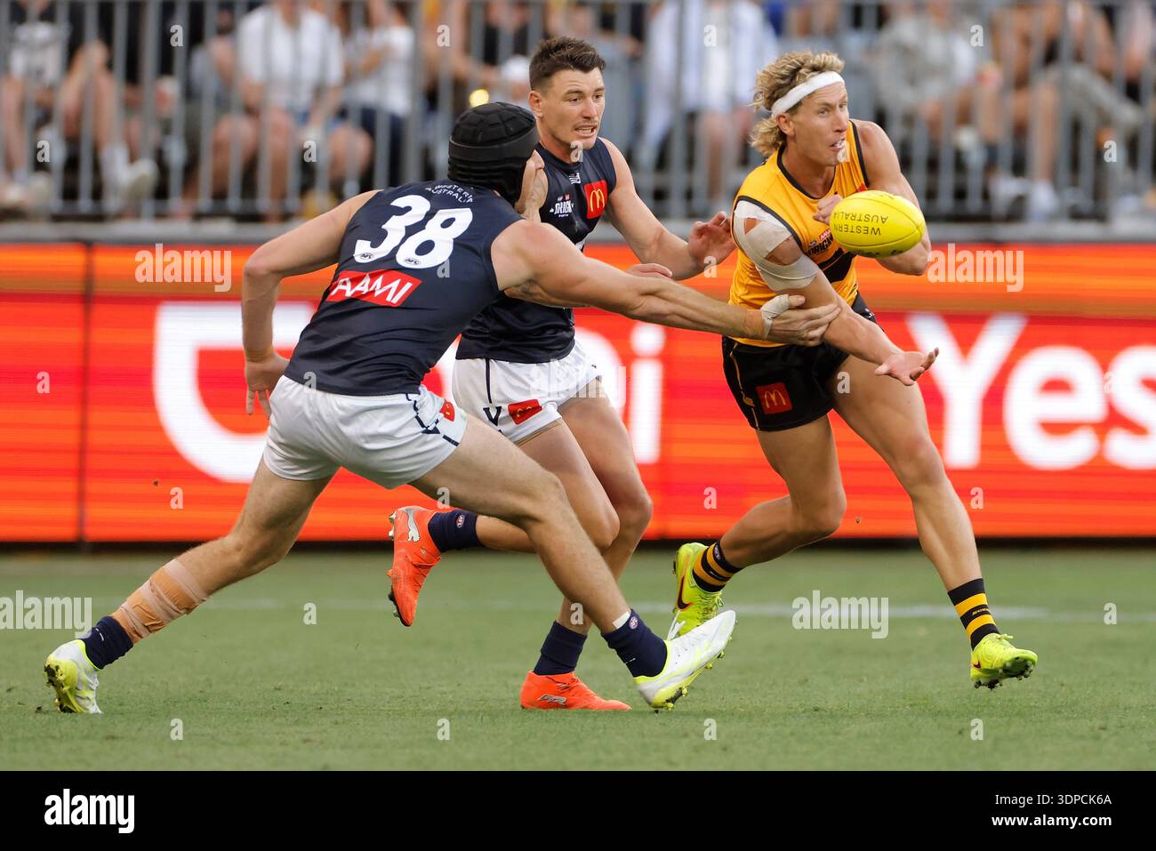 Aaron Naughton of Western Australia handballs during the AFL Origin ...