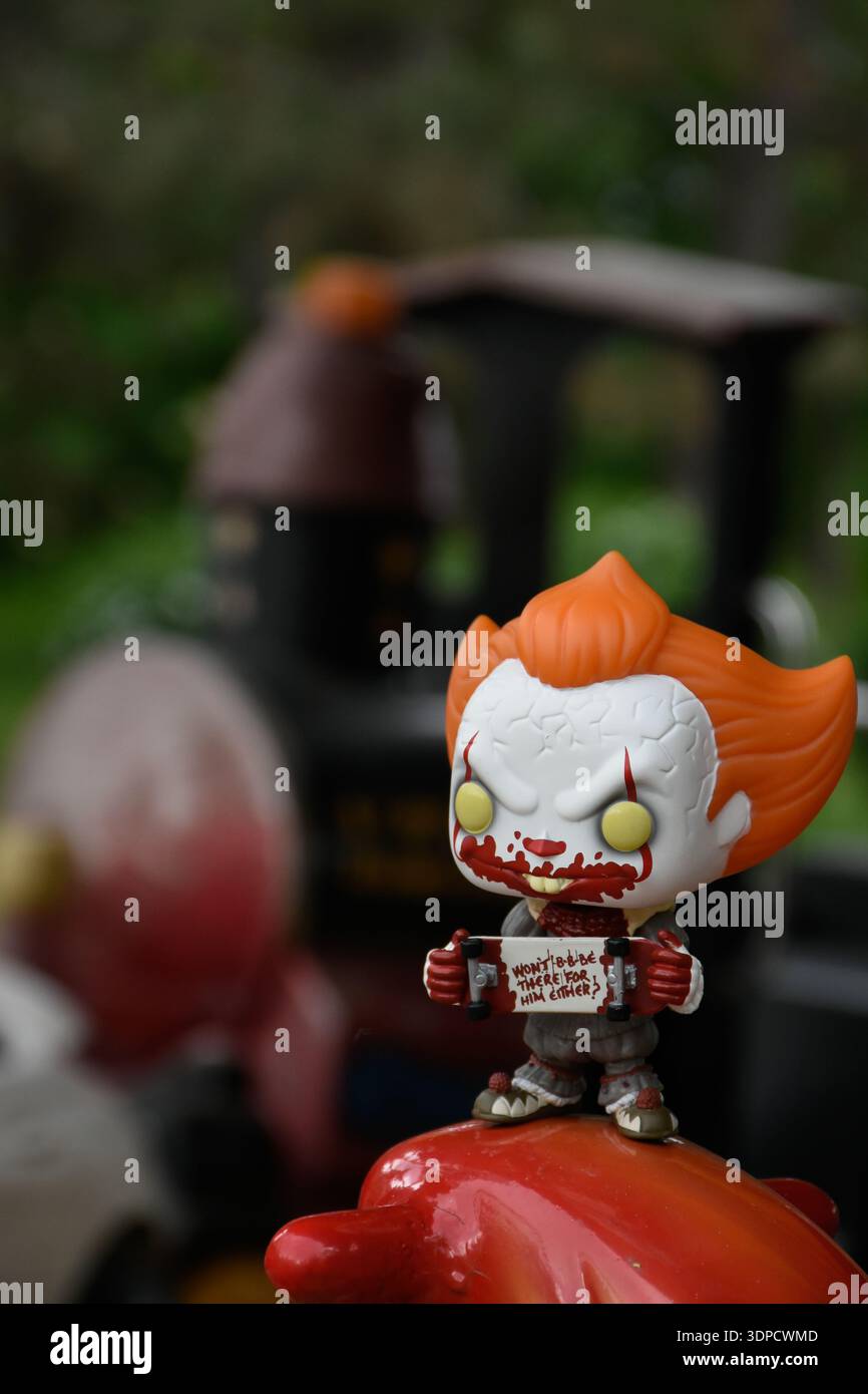 Funko Pop action figure of Pennywise evil clown with bloody skateboard ...