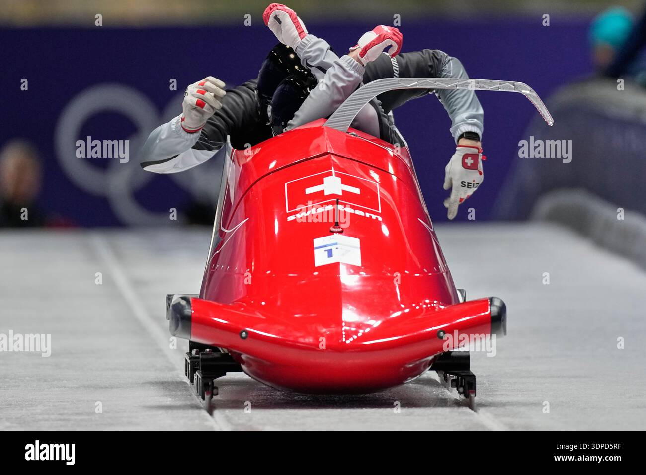 Switzerland's Timo Rohner, front, starts for a two man bobsled training ...