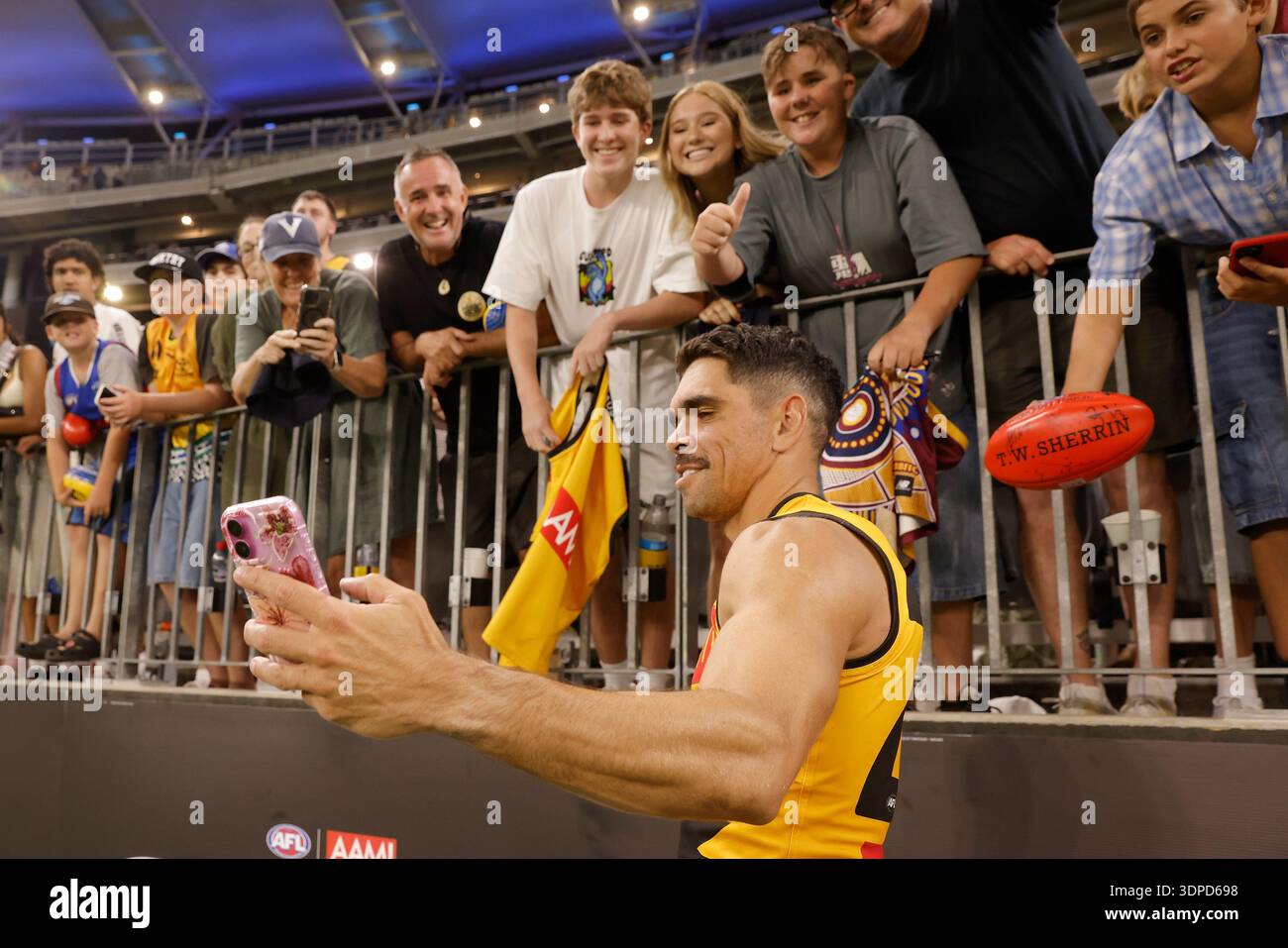 Charlie Cameron of Western Australia takes a selfie with fans after the ...