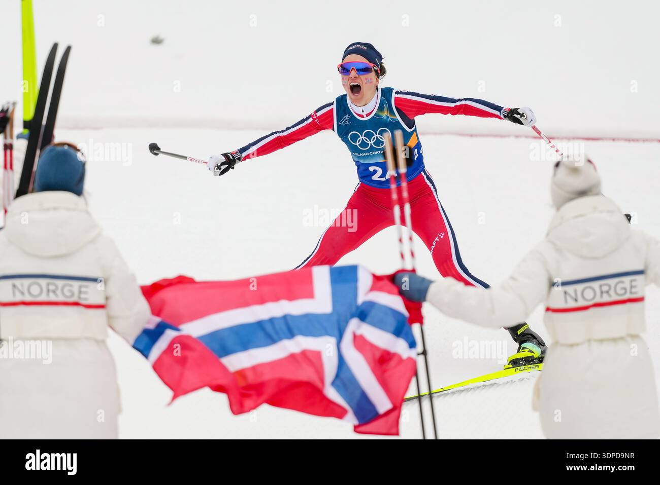 Heidi Weng, of Norway, celebrates with her teammates after crossing the ...