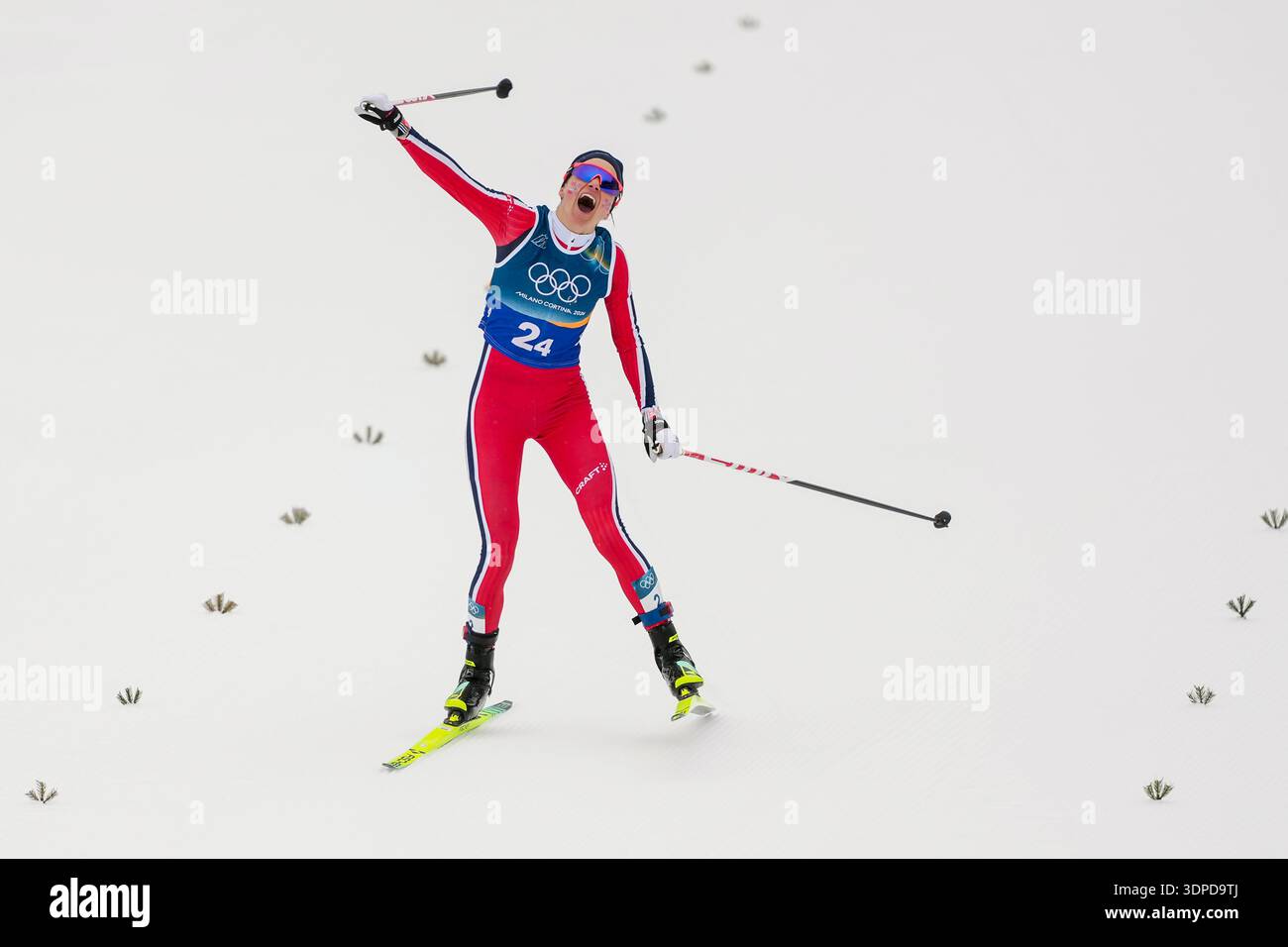 Heidi Weng, of Norway, celebrates as she approaches the finish line to ...