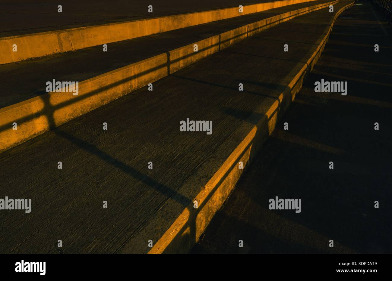 Long shadows cast railing hi-res stock photography and images - Alamy