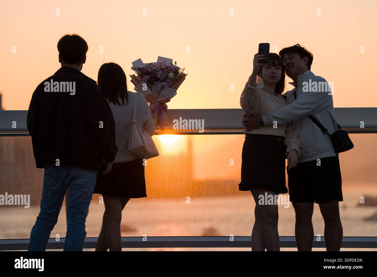 Two couples during sunset on valentines day in Hong Kong, February 14 ...