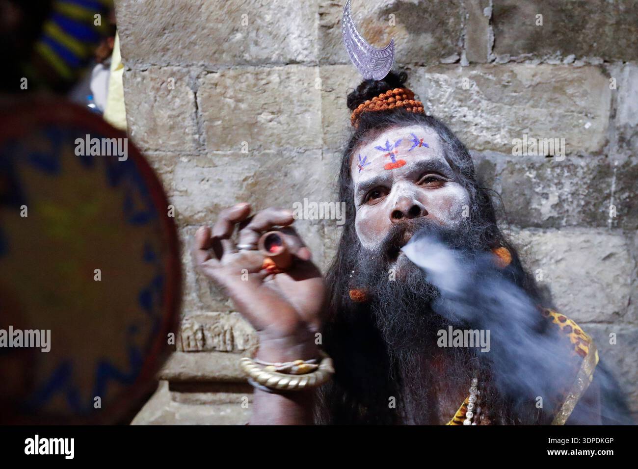 February 14, 2026, Kathmandu, Nepal: A Sadhu smokes a chillum filled ...