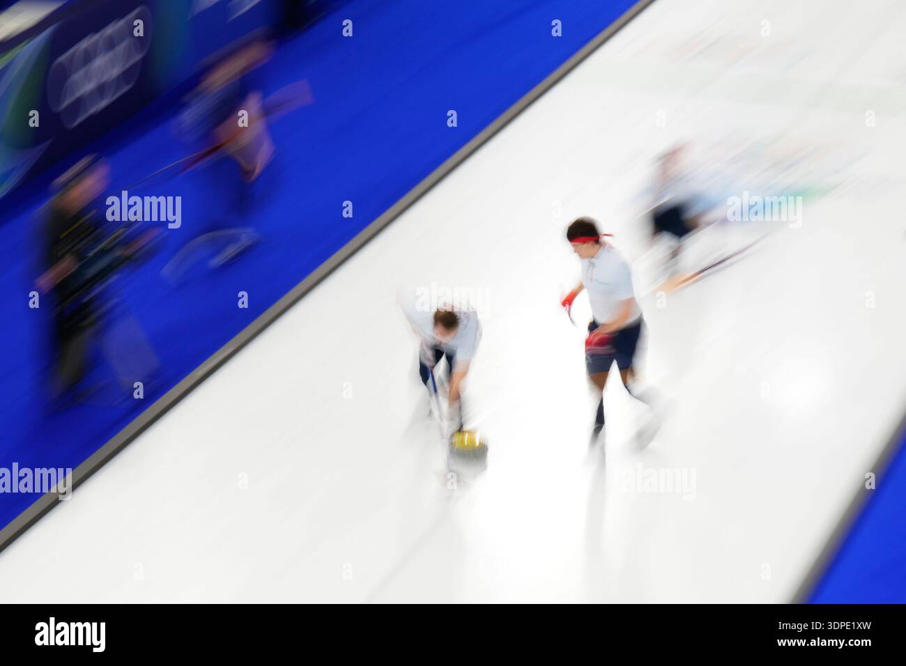 United States' Luc Violette and Aidan Oldenburg sweep ahead of a stone ...